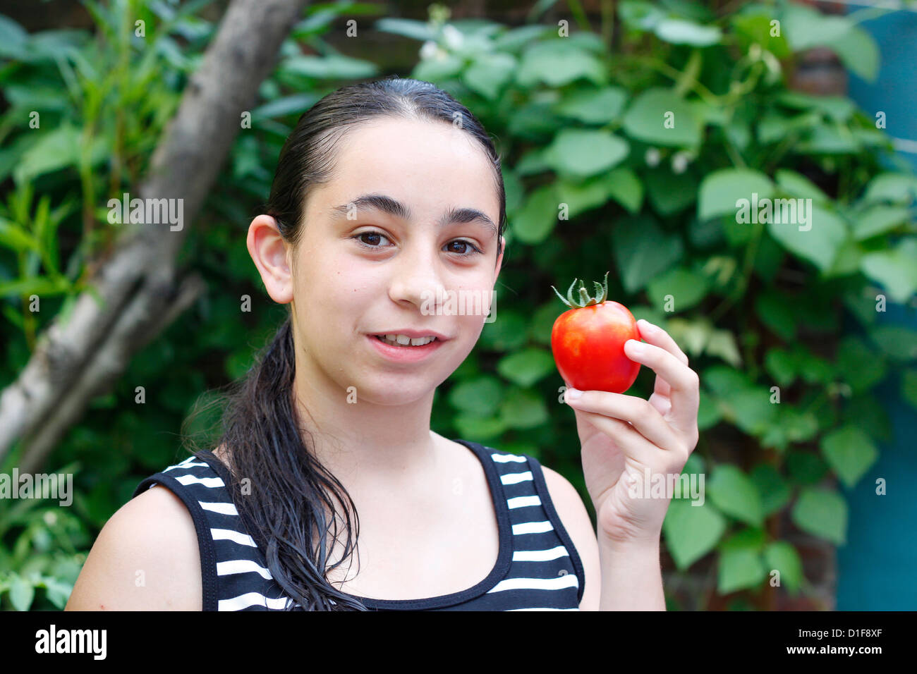 girl with tomato Stock Photo - Alamy
