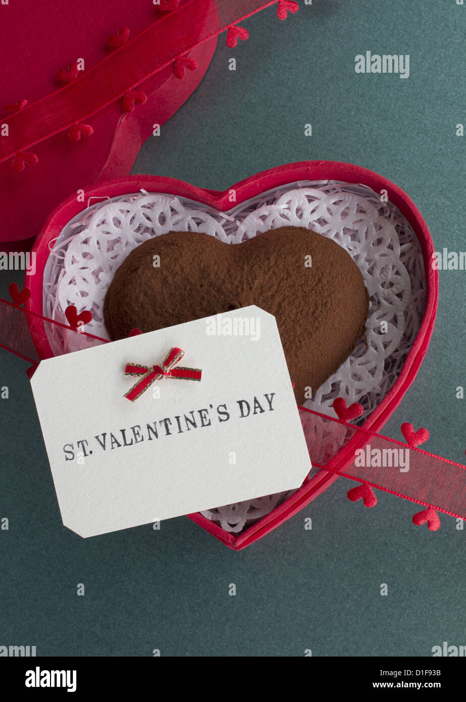 Heart-shaped chocolate and a message card Stock Photo - Alamy