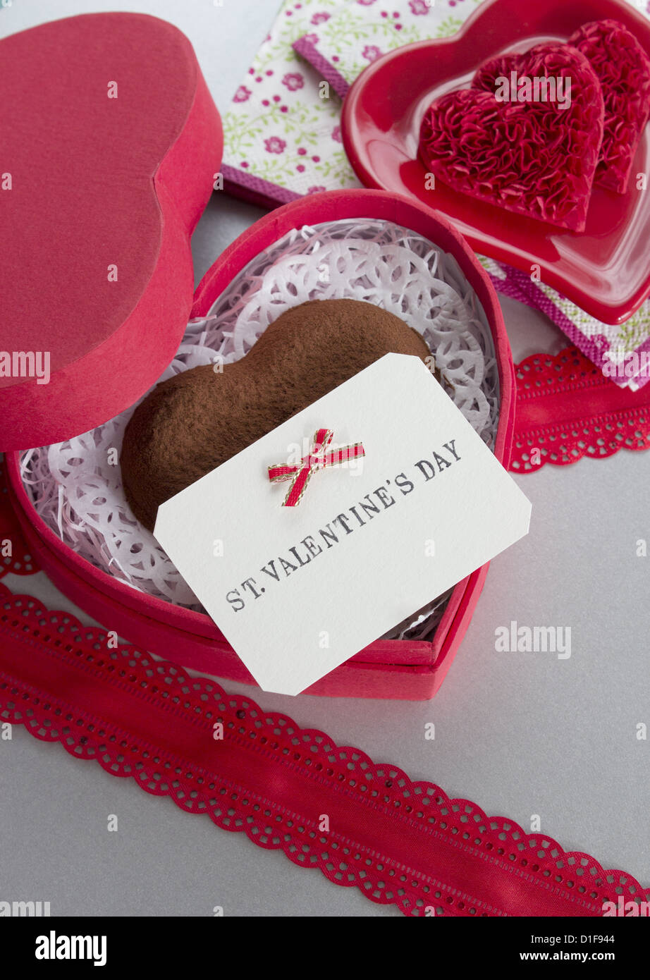 Heart-shaped chocolate and a message card Stock Photo - Alamy