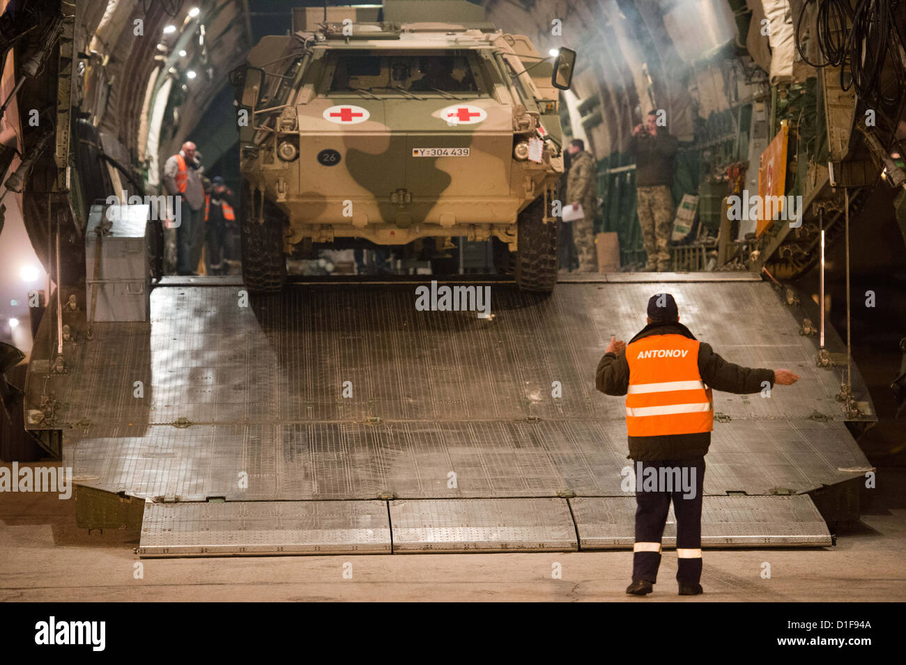 Specialists load a device into the cargo plane Antonov in the Camp ...
