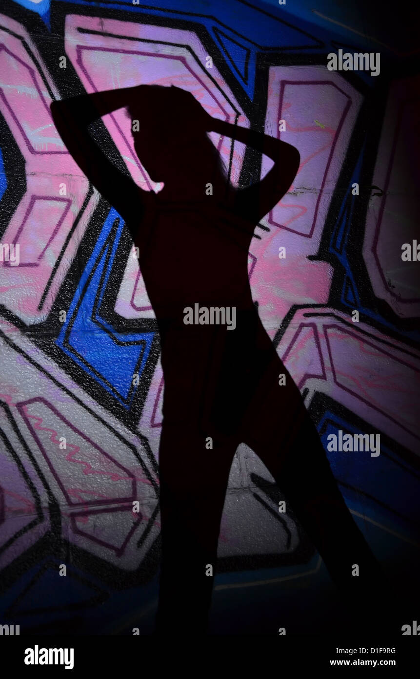 The shadow of the girl on a background of graffiti Stock Photo - Alamy