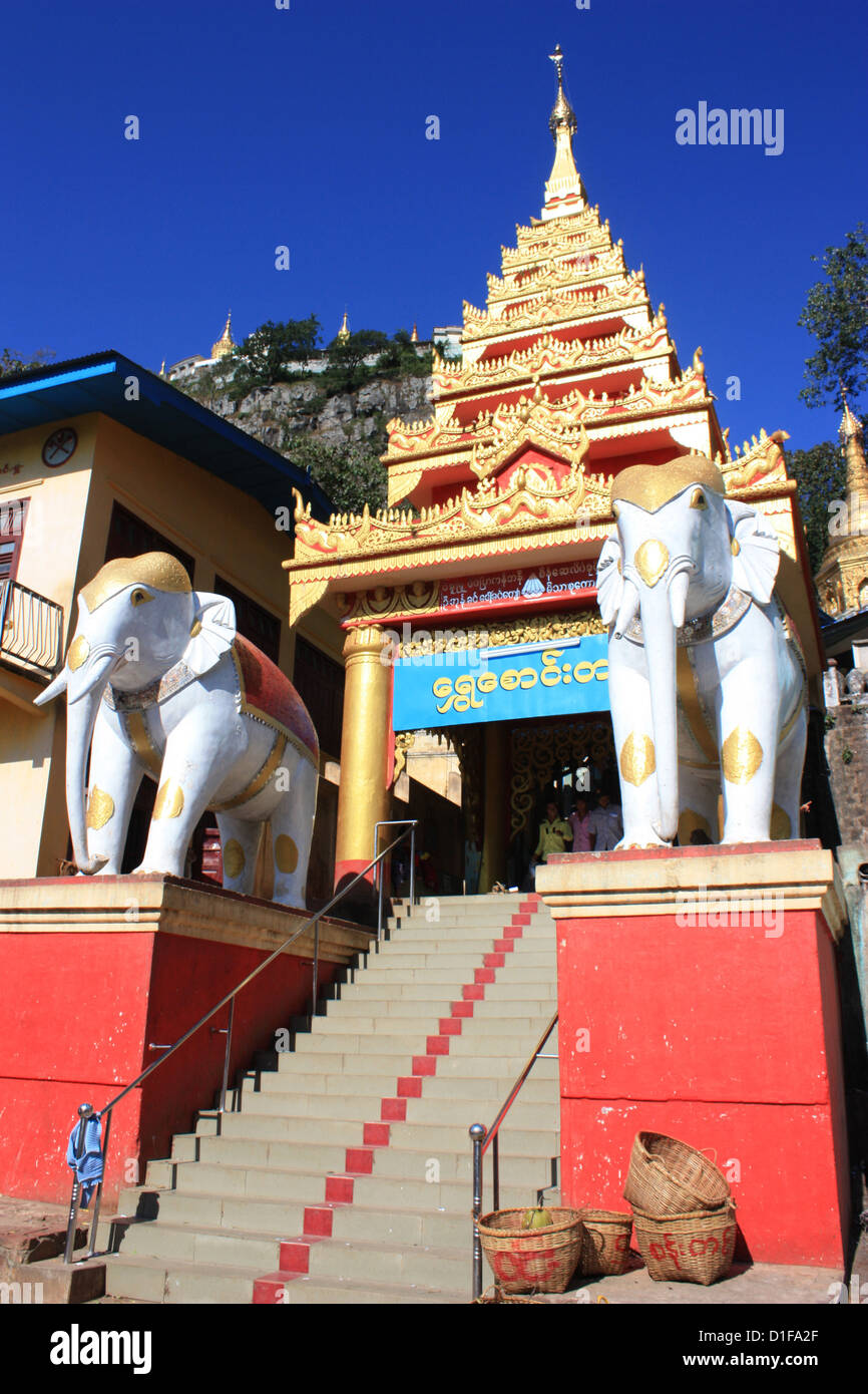 Buildings are seen below the Mount Popa in the Kyaukpadaung Township ...