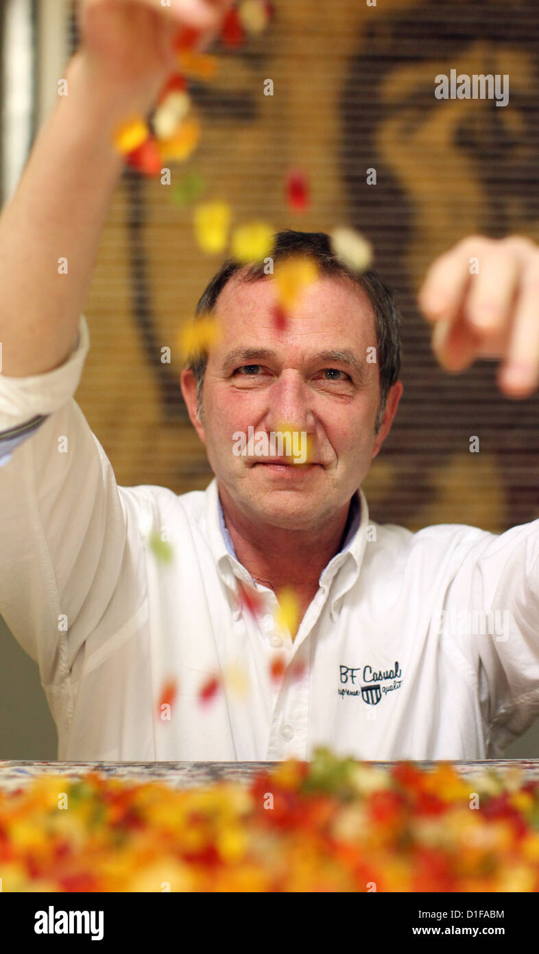 Artist Johannes Cordes works on a picture made from gummy bears in his ...