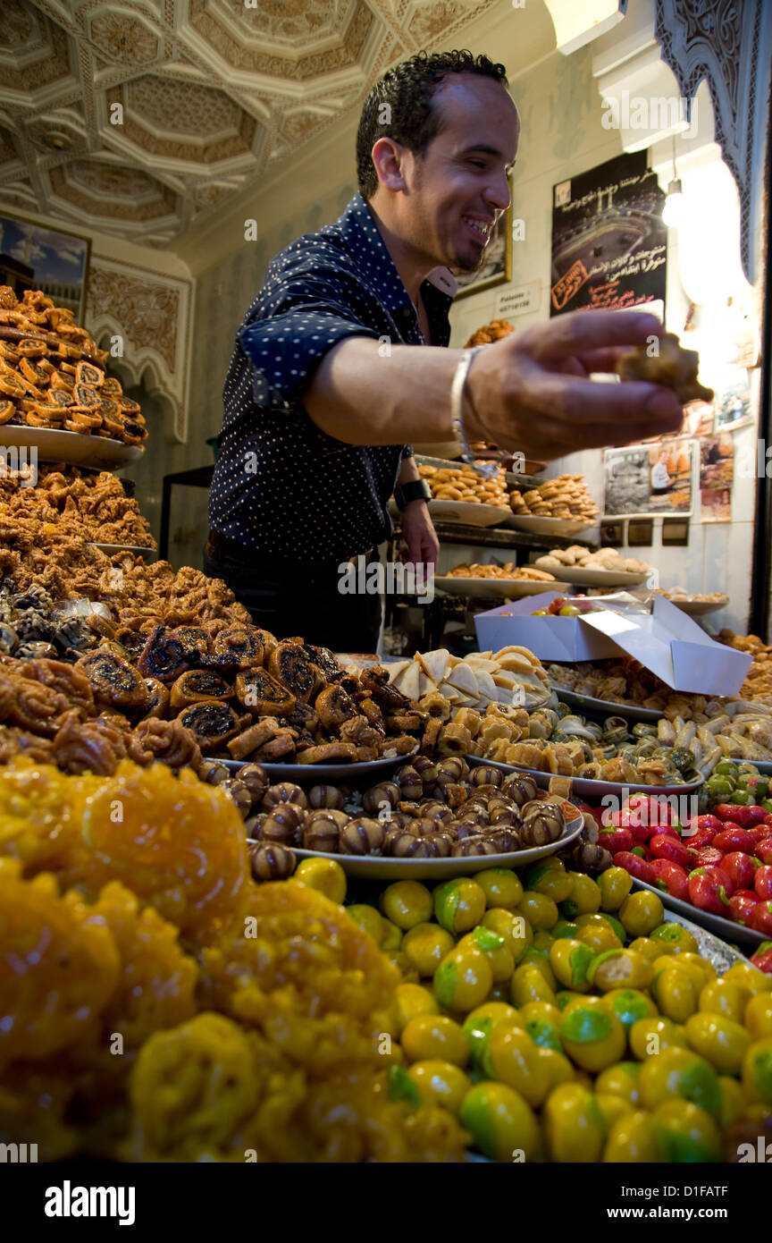 A stall selling colourful sweets in the souk in Marrakech, Morocco ...