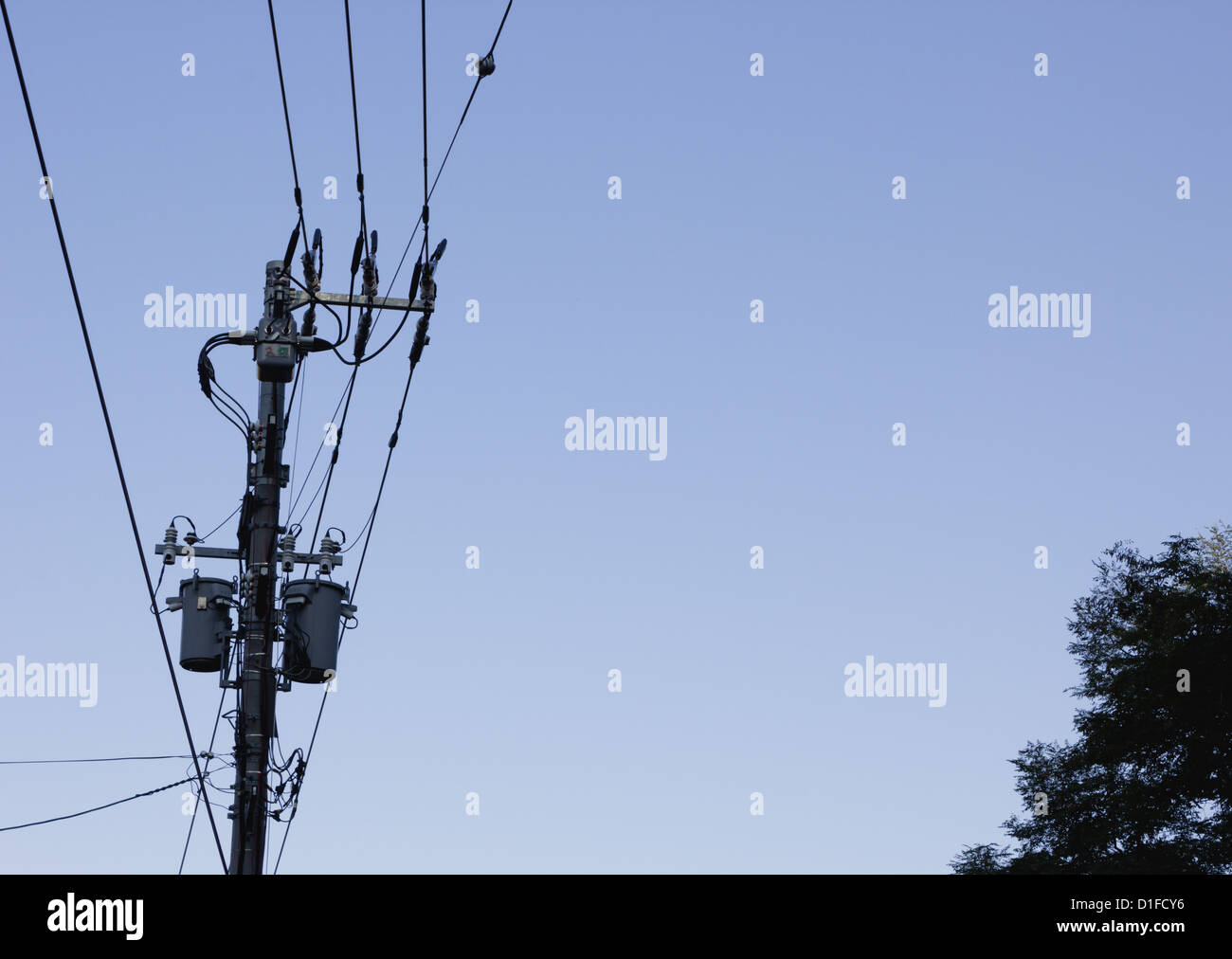 Blue sky and utility pole with lines Stock Photo - Alamy