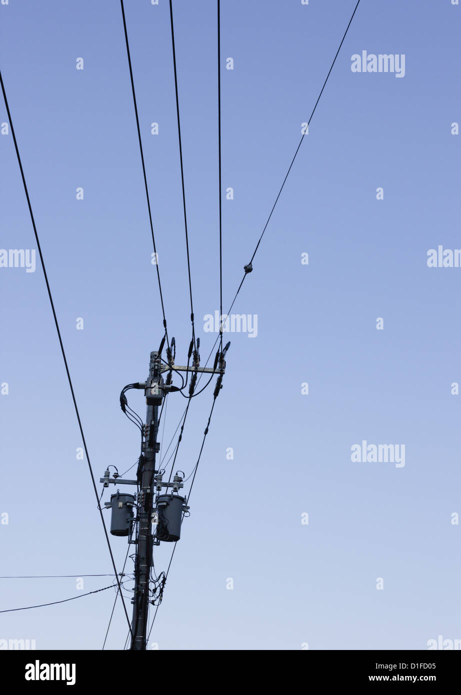 Blue sky and utility pole with lines Stock Photo - Alamy