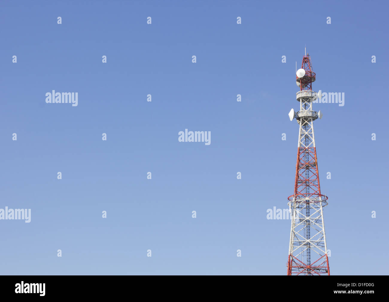 Blue sky and a broadcasting tower Stock Photo - Alamy
