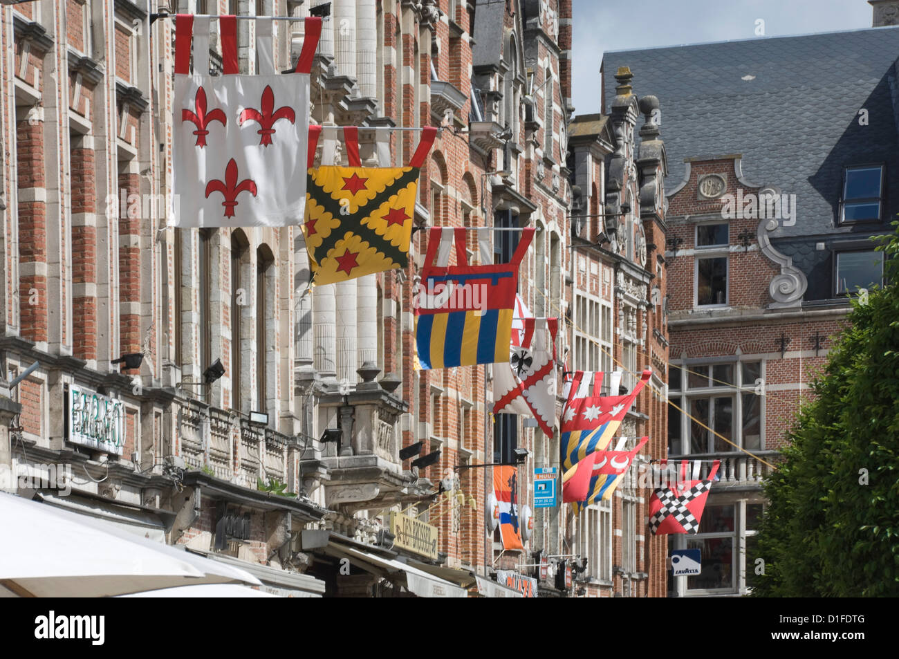Heraldic banners decorate the Flemish gables in Leuven, Belgium, Europe ...