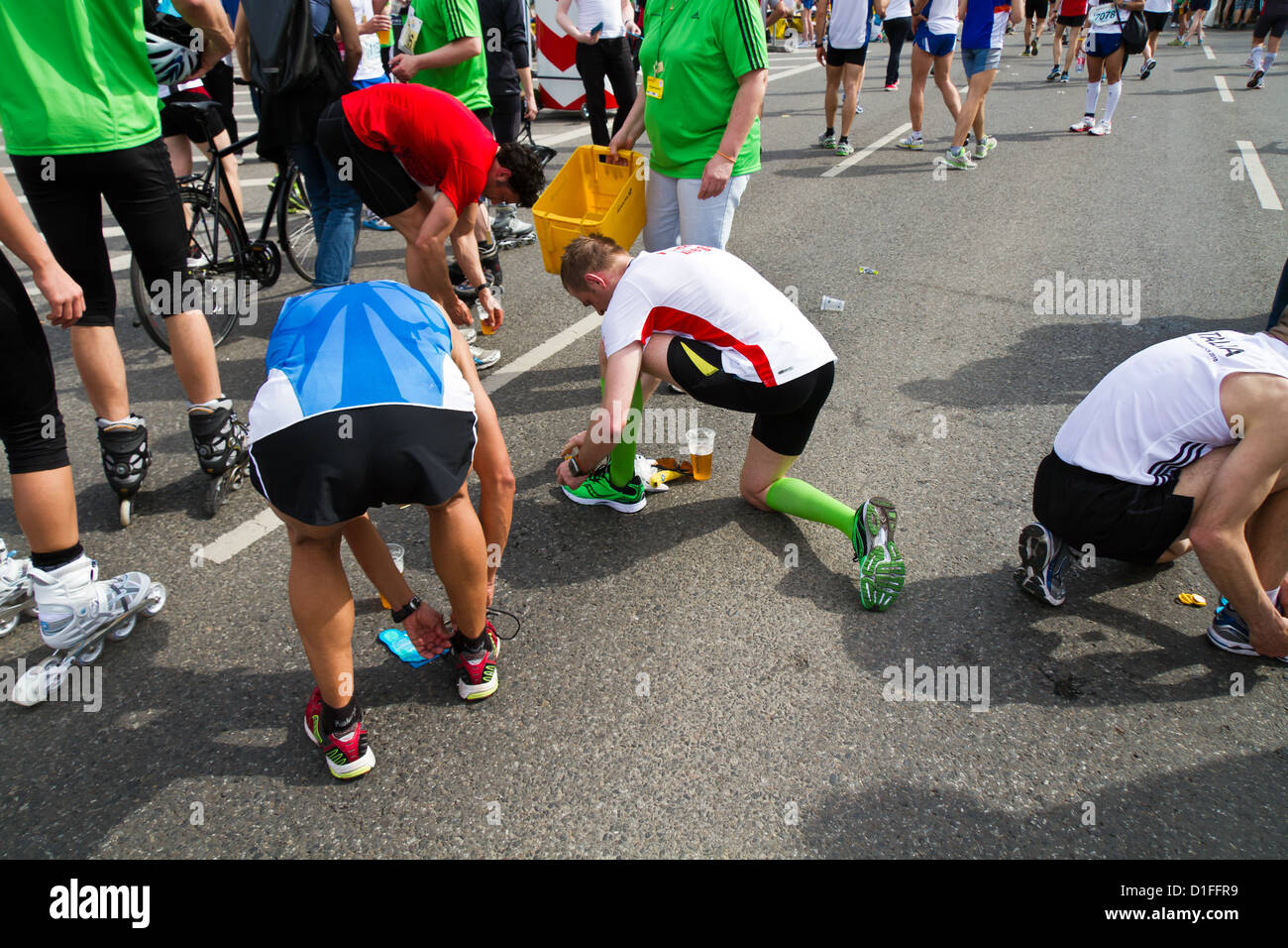 Runners fastening their Shoes just after Finish of the Berlin Half ...