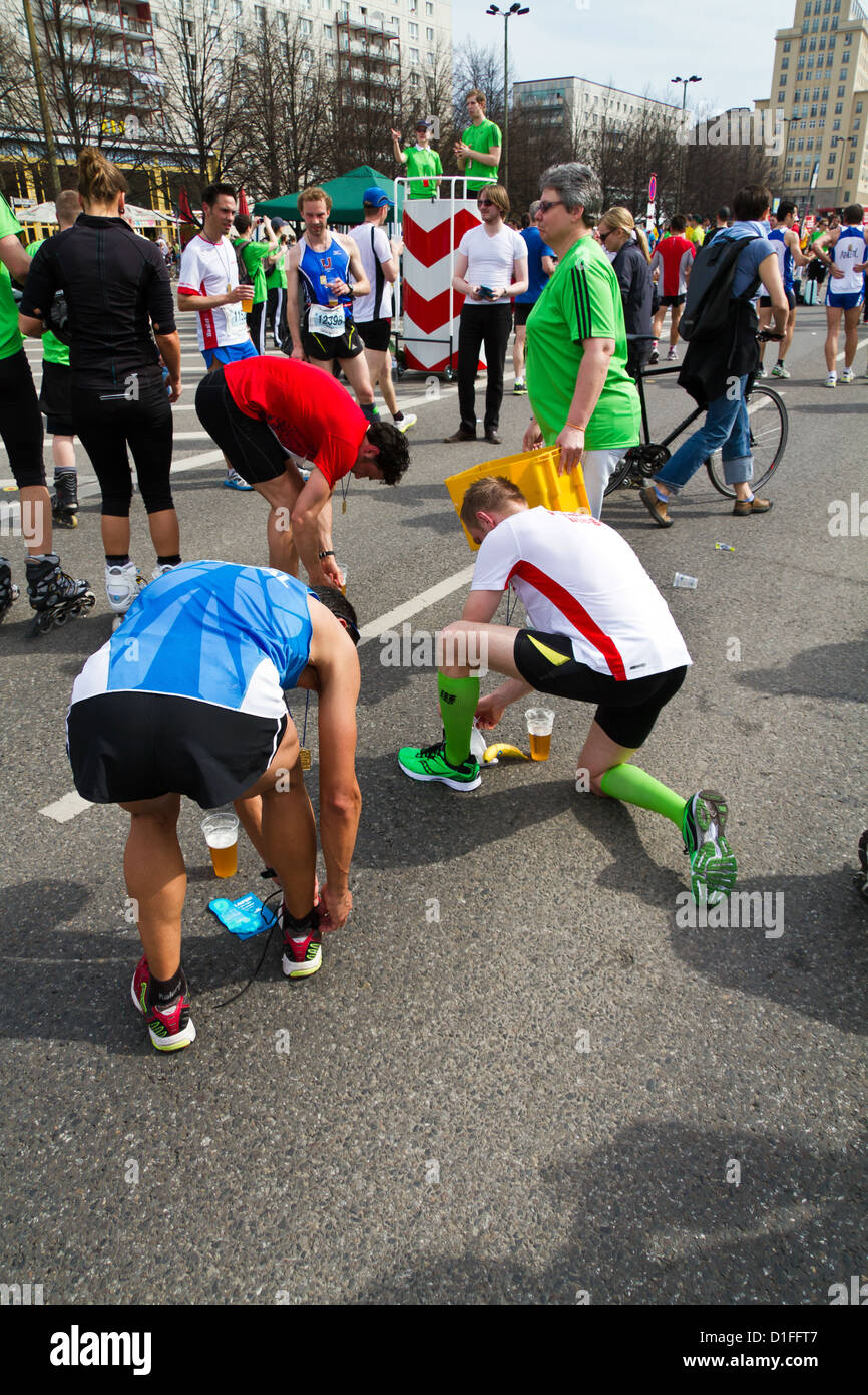 Runners fastening their Shoes just after Finish of the Berlin Half ...