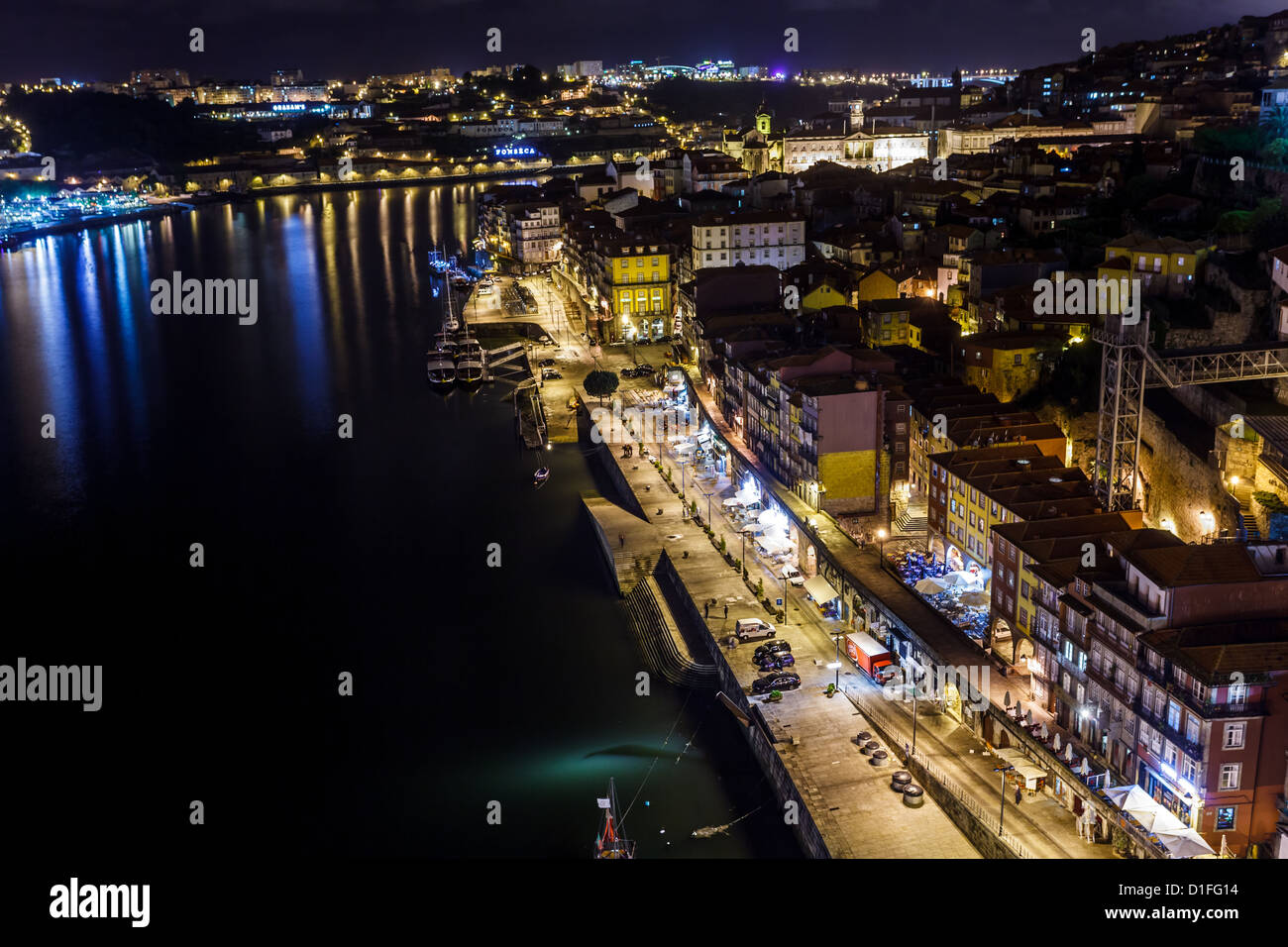 Colorful view of the riverfront and docks with lights reflecting in the ...