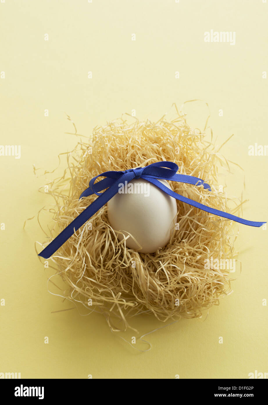 Egg tied with a ribbon Stock Photo - Alamy