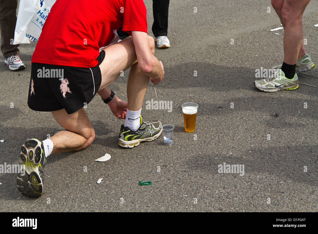 Runners fastening their Shoes just after Finish of the Berlin Half ...
