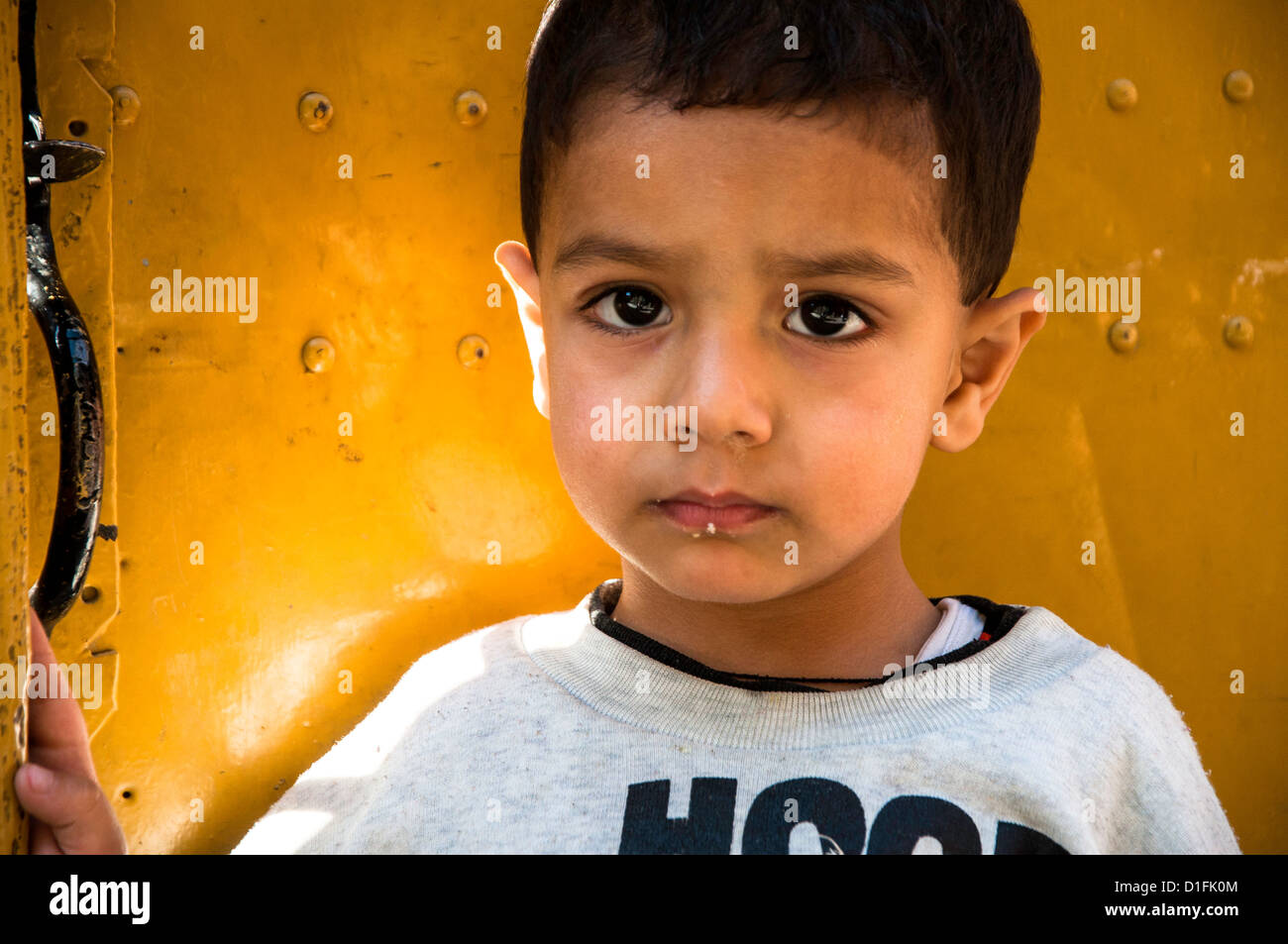 Young boy at the doorstep of his home Stock Photo - Alamy