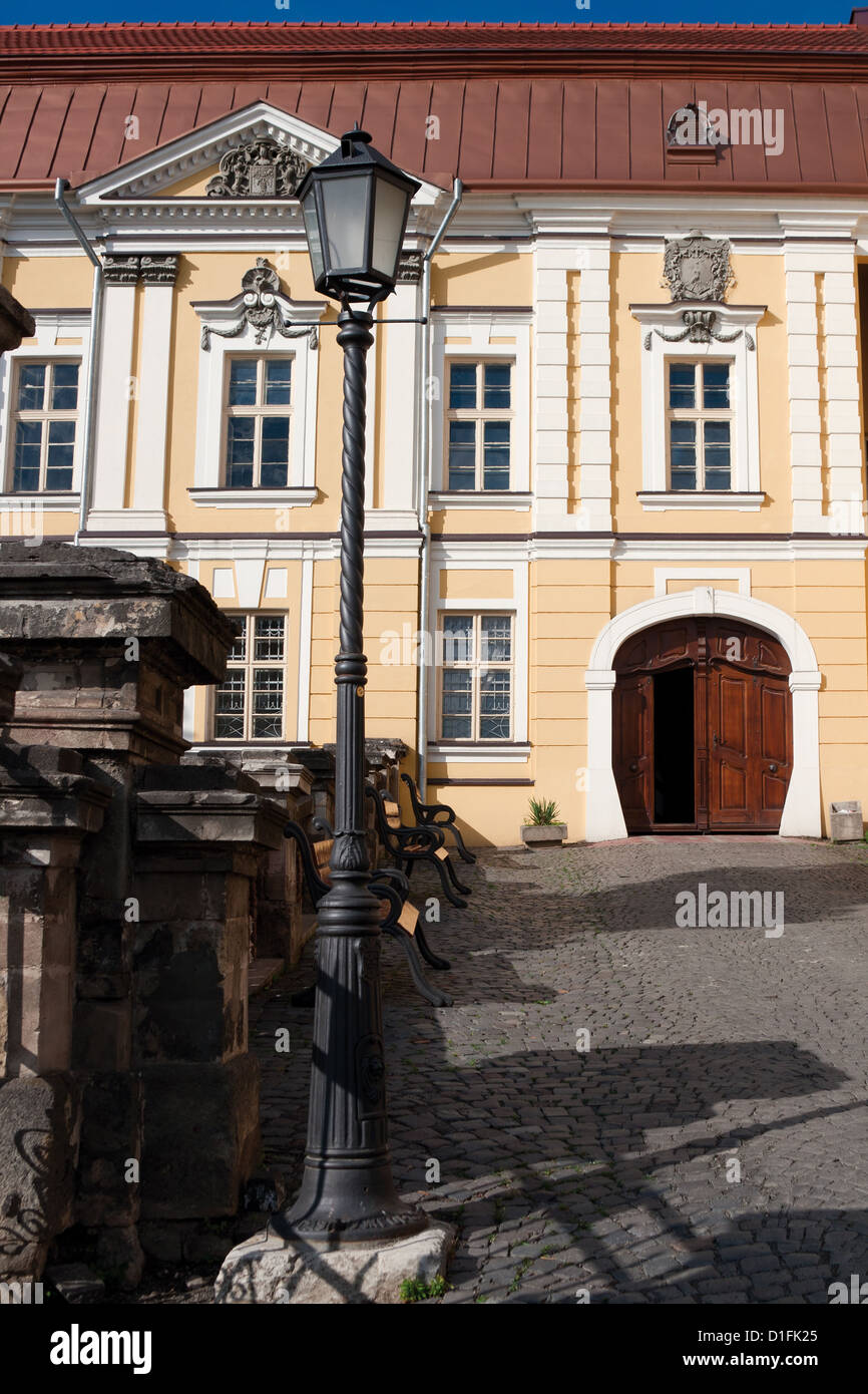 A Jesuit monastery built in 1646, a wooden gates, and street lamp in ...