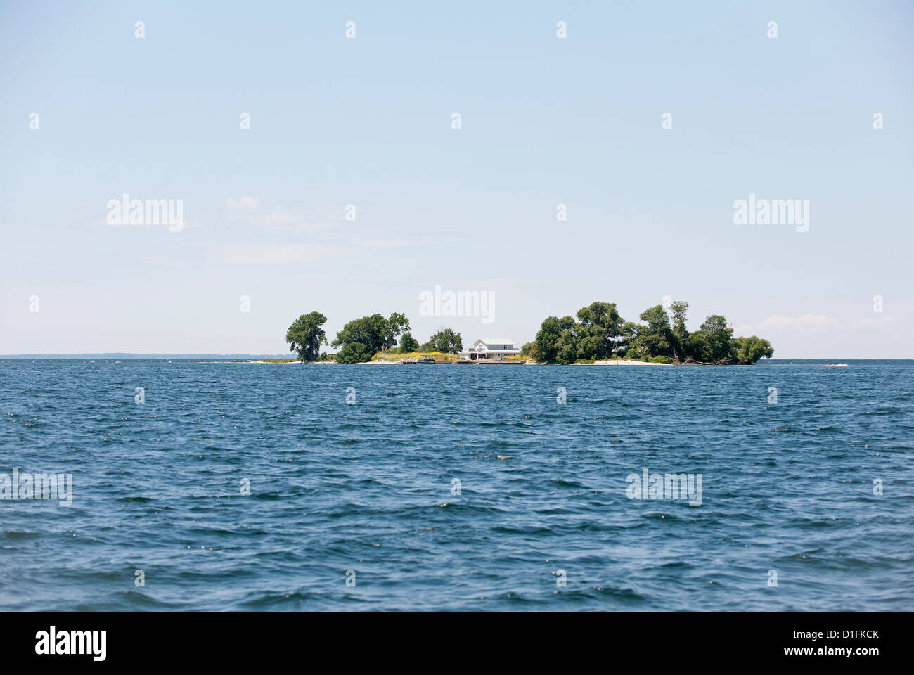 Single house situated on an island Stock Photo - Alamy