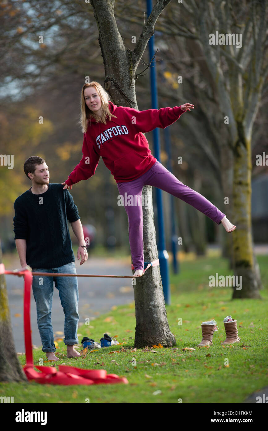 A woman Aberystwyth university student practicing slack rope walking ...