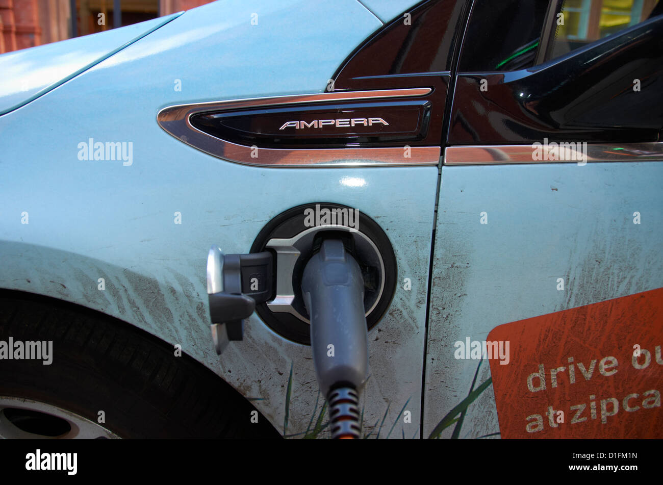 Electric car charging up Stock Photo - Alamy