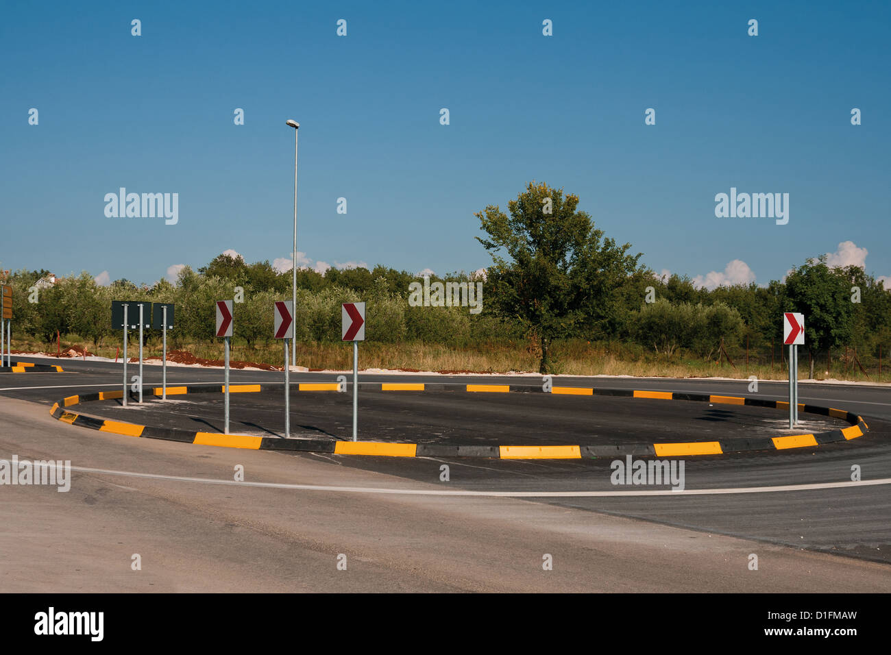 Small circle country road interchange Stock Photo - Alamy