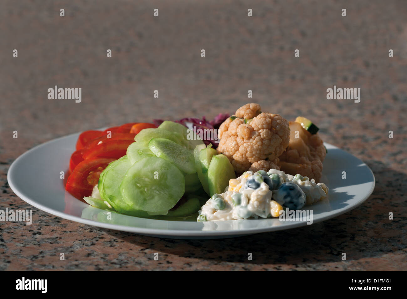 Mixed vegetable salad on marble background Stock Photo - Alamy