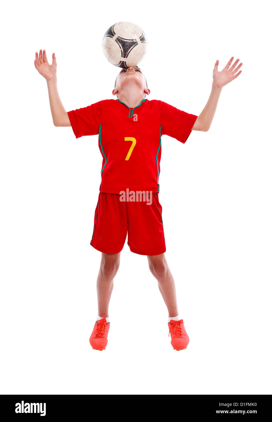 Young boy making trick with soccer ball, studio shot Stock Photo - Alamy