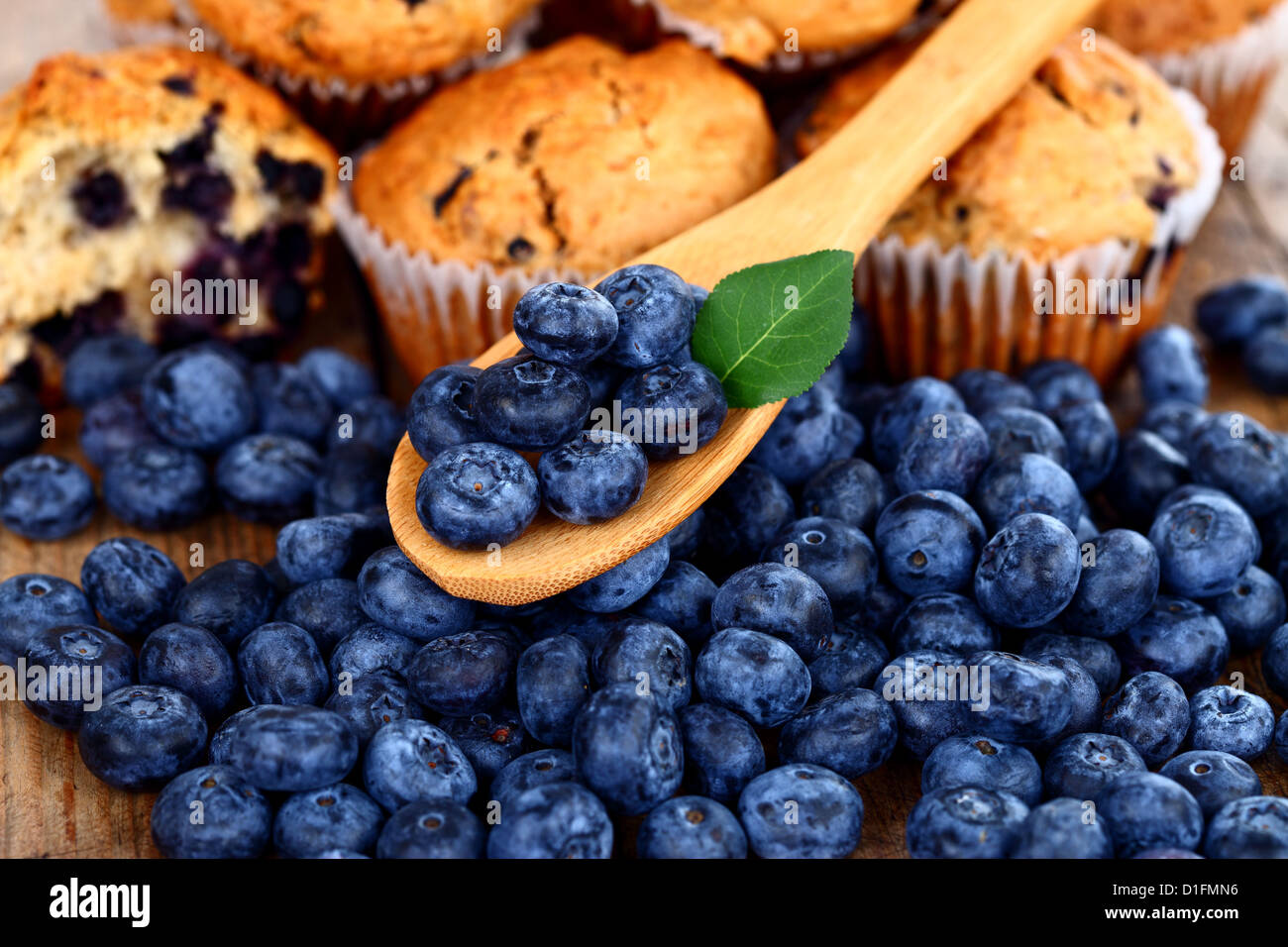 Homemade muffins with fresh blueberries on wooden spoon Stock Photo - Alamy