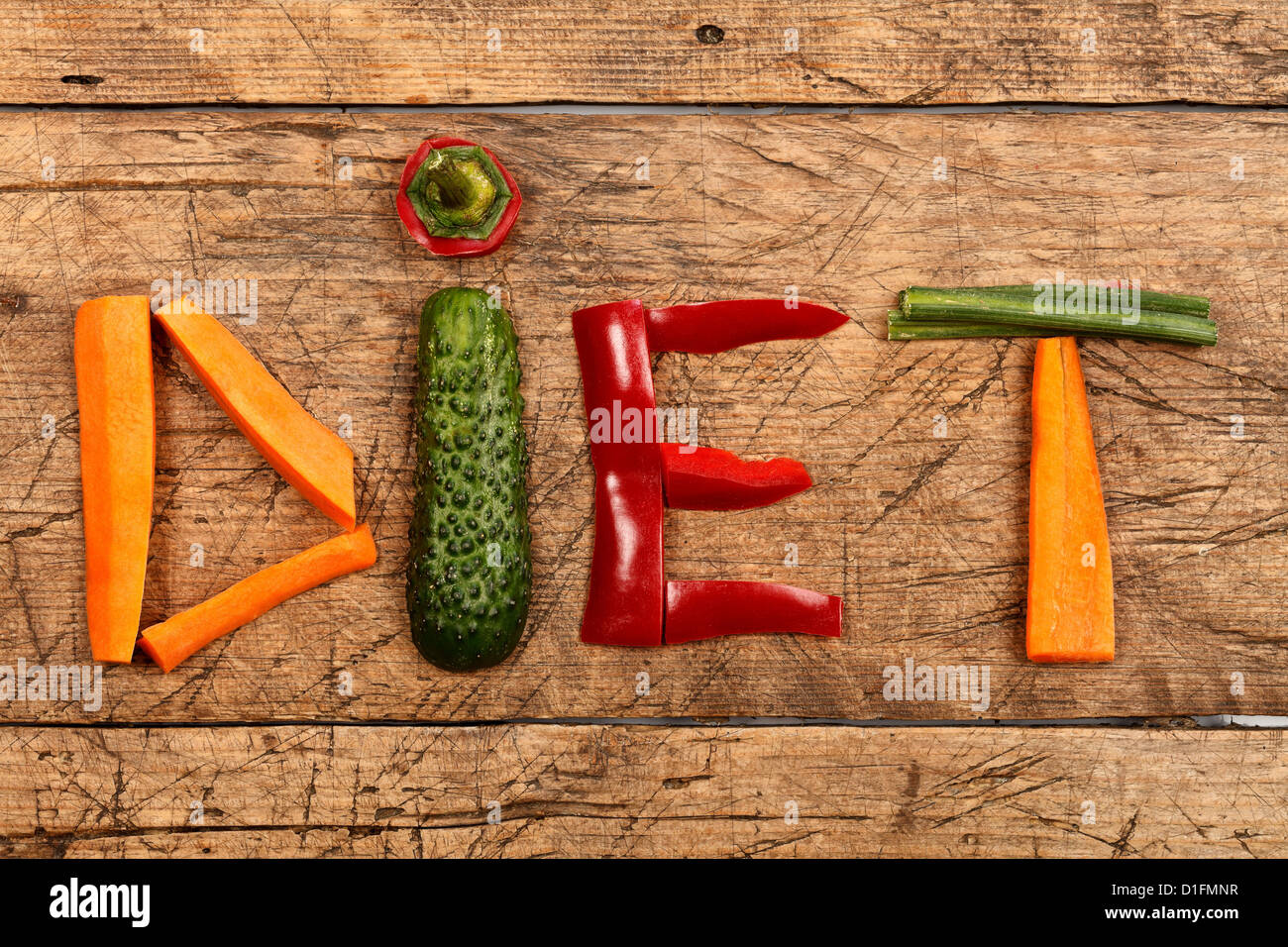 Diet written of vegetable slices on rustic wooden table Stock Photo - Alamy