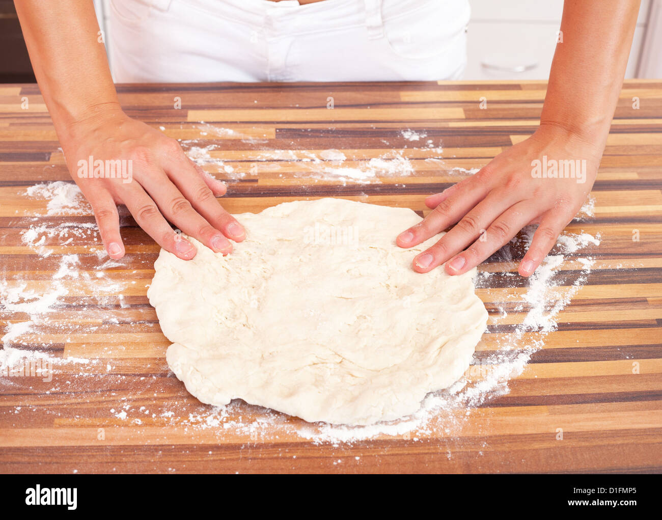 Hands of a woman making dough in the kitchen Stock Photo - Alamy