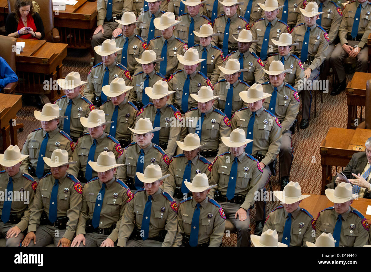Members of the graduating class of Texas state troopers sit during ...
