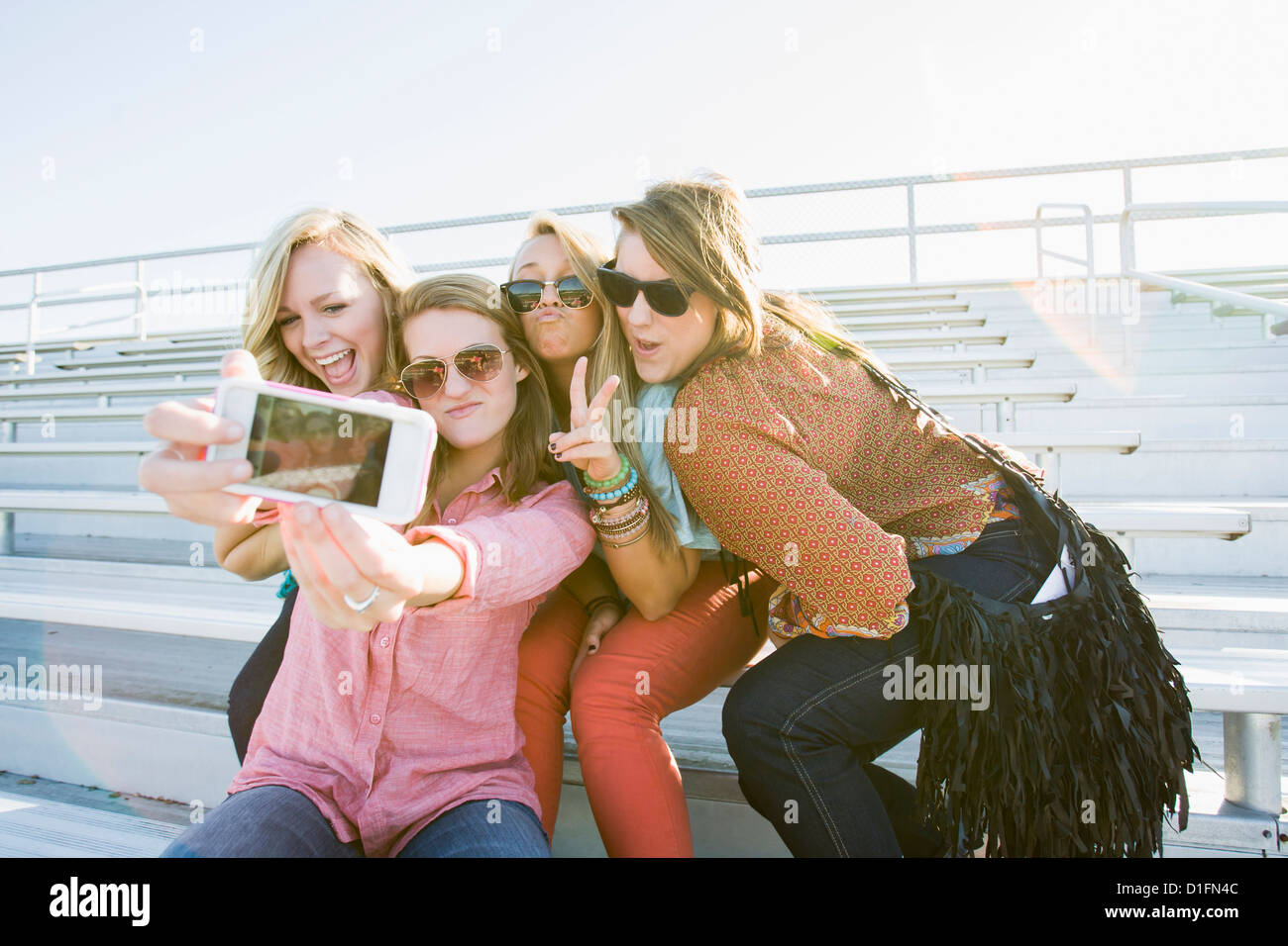 Friends taking self-portrait Stock Photo - Alamy