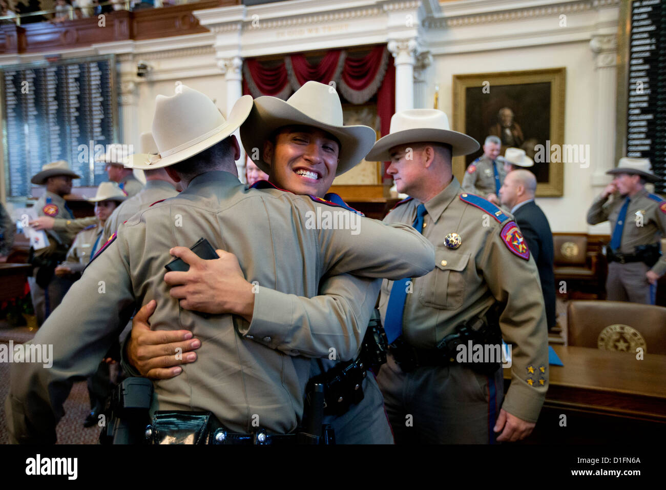 Members of the graduating class of Texas state troopers congratulate ...