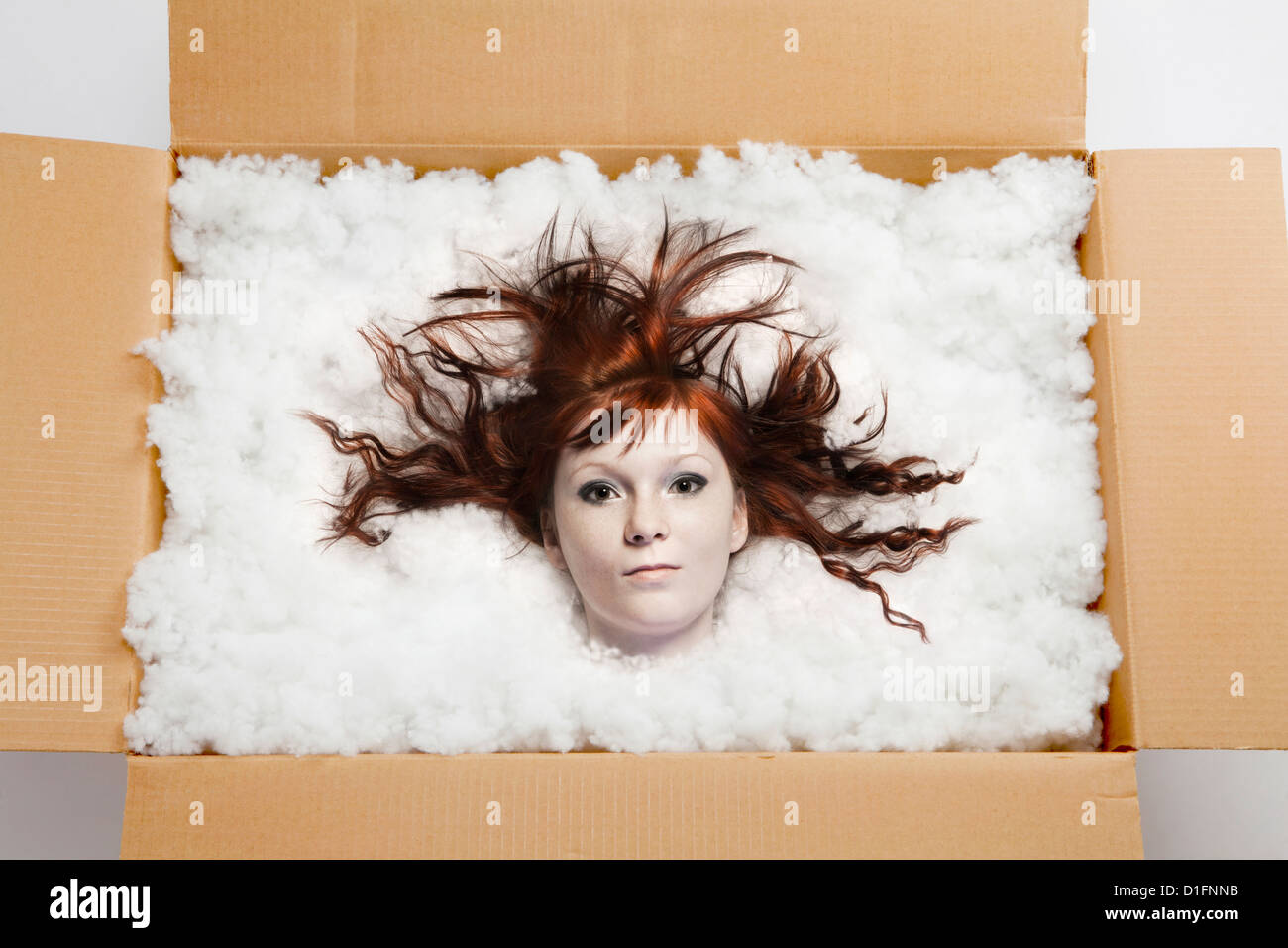 Head of a young woman in a cardboard box Stock Photo - Alamy
