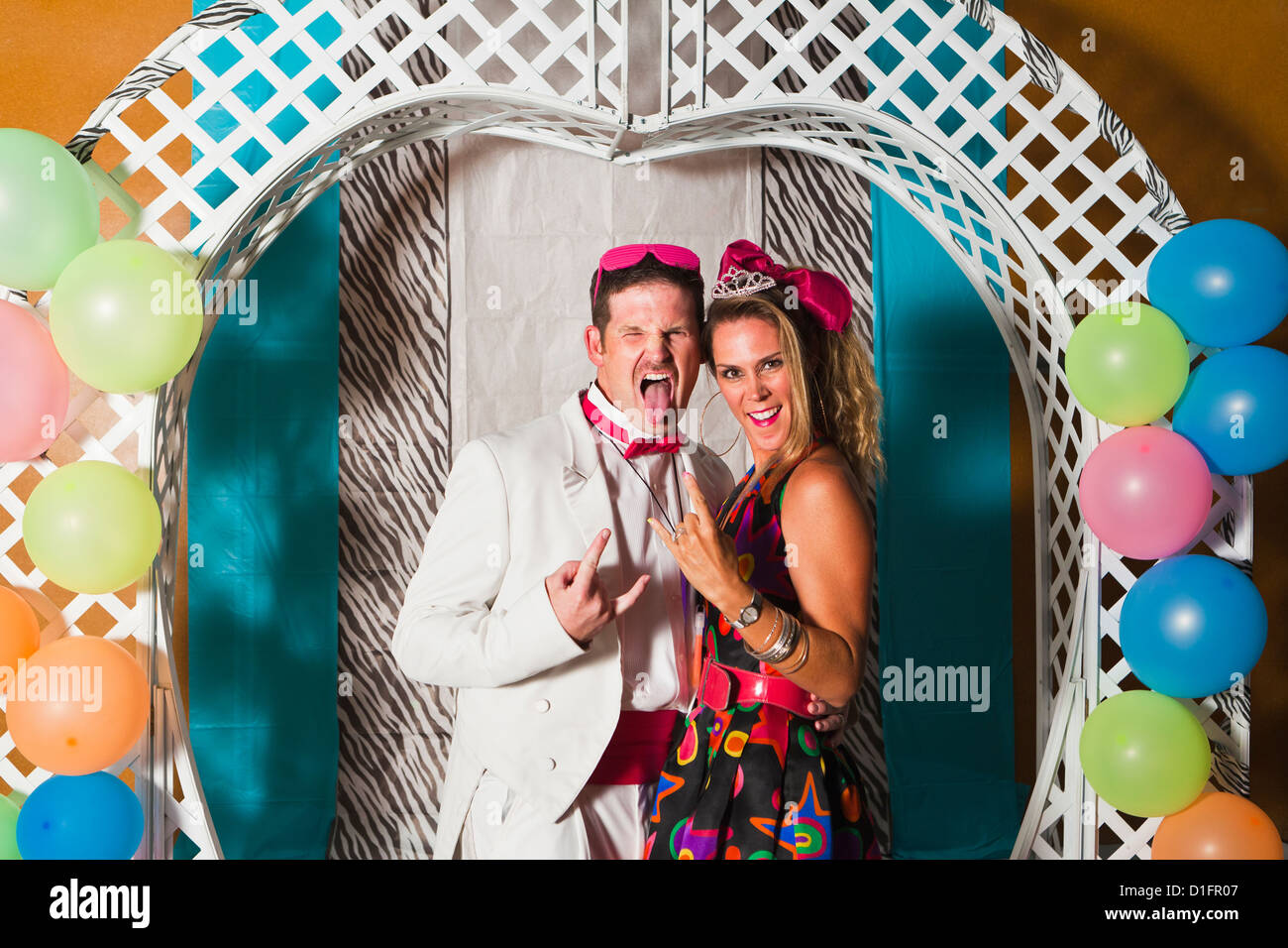 Caucasian couple at retro prom Stock Photo - Alamy