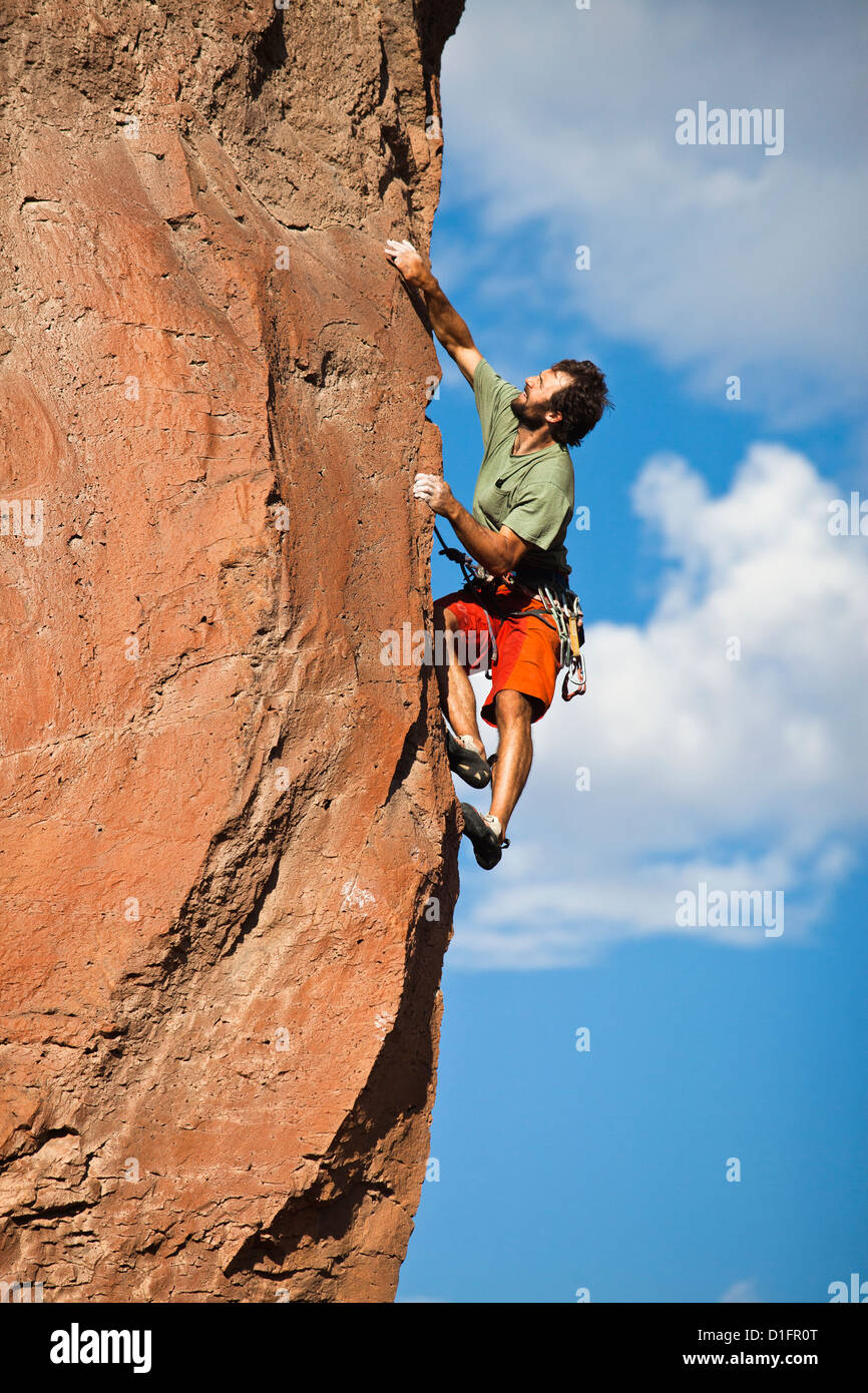 Man clinging danger hi-res stock photography and images - Alamy