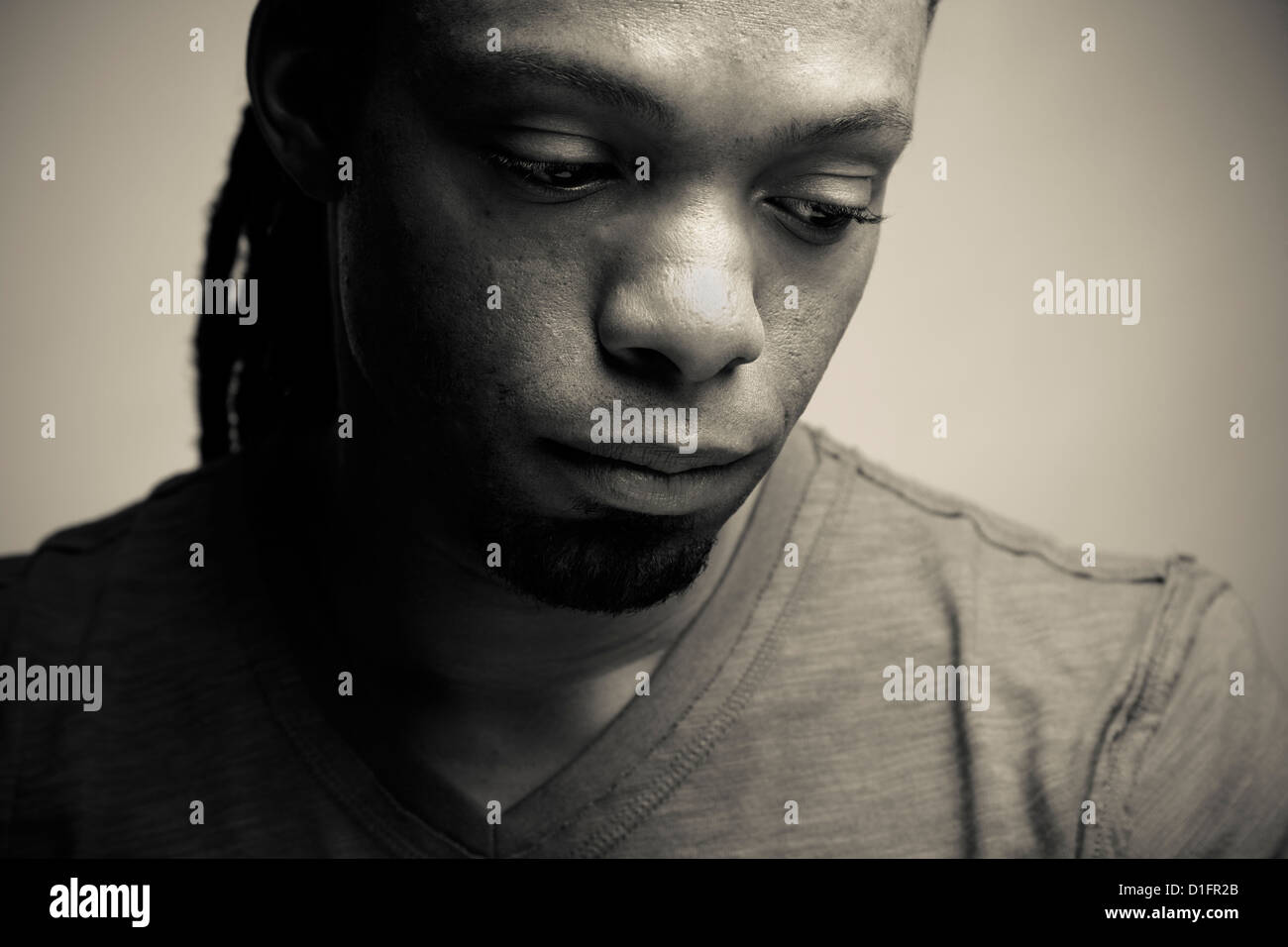 Serious African American man looking down Stock Photo - Alamy