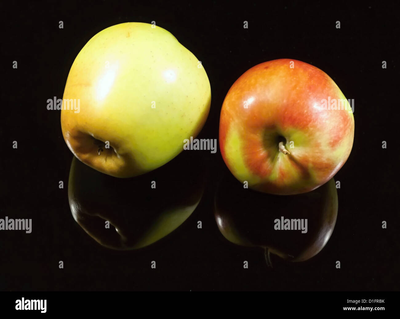 Two apples on black background with shadow Stock Photo - Alamy