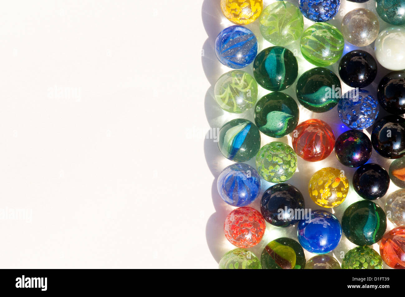 Marbles on white background Stock Photo - Alamy