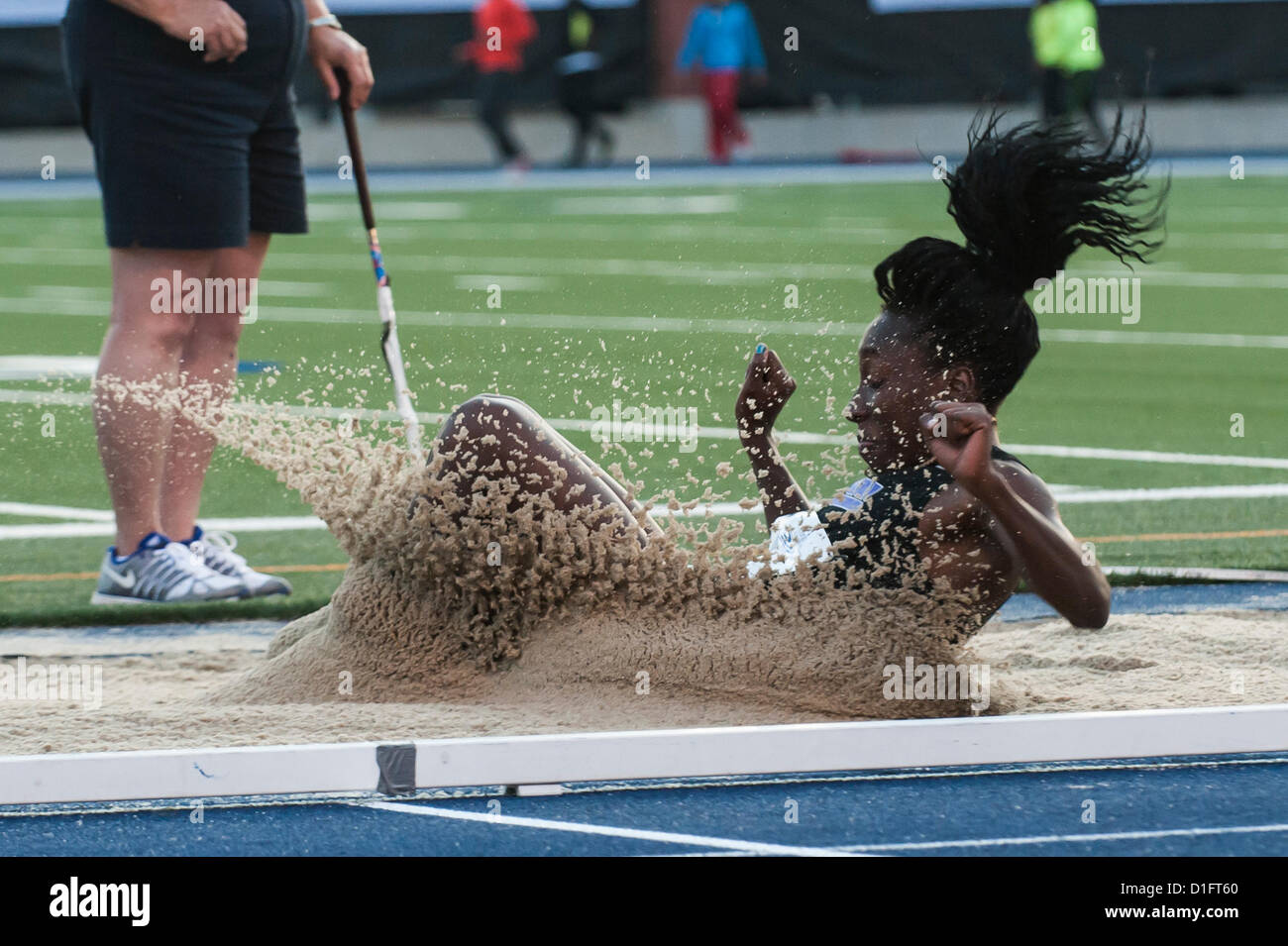 An athlete competes in the long jump event of the 2012 Toronto ...