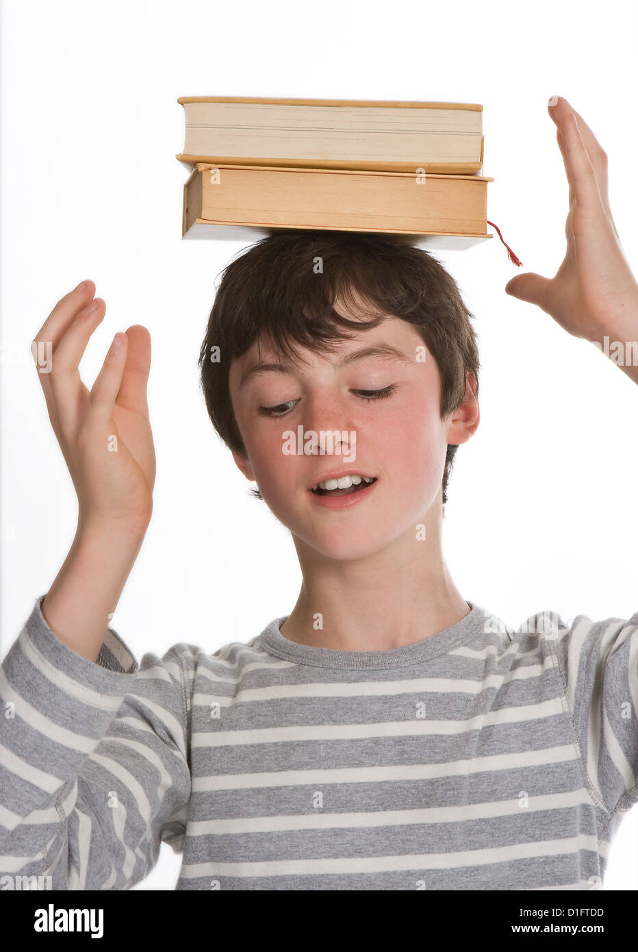 Teenager boy playing with his study books Stock Photo - Alamy