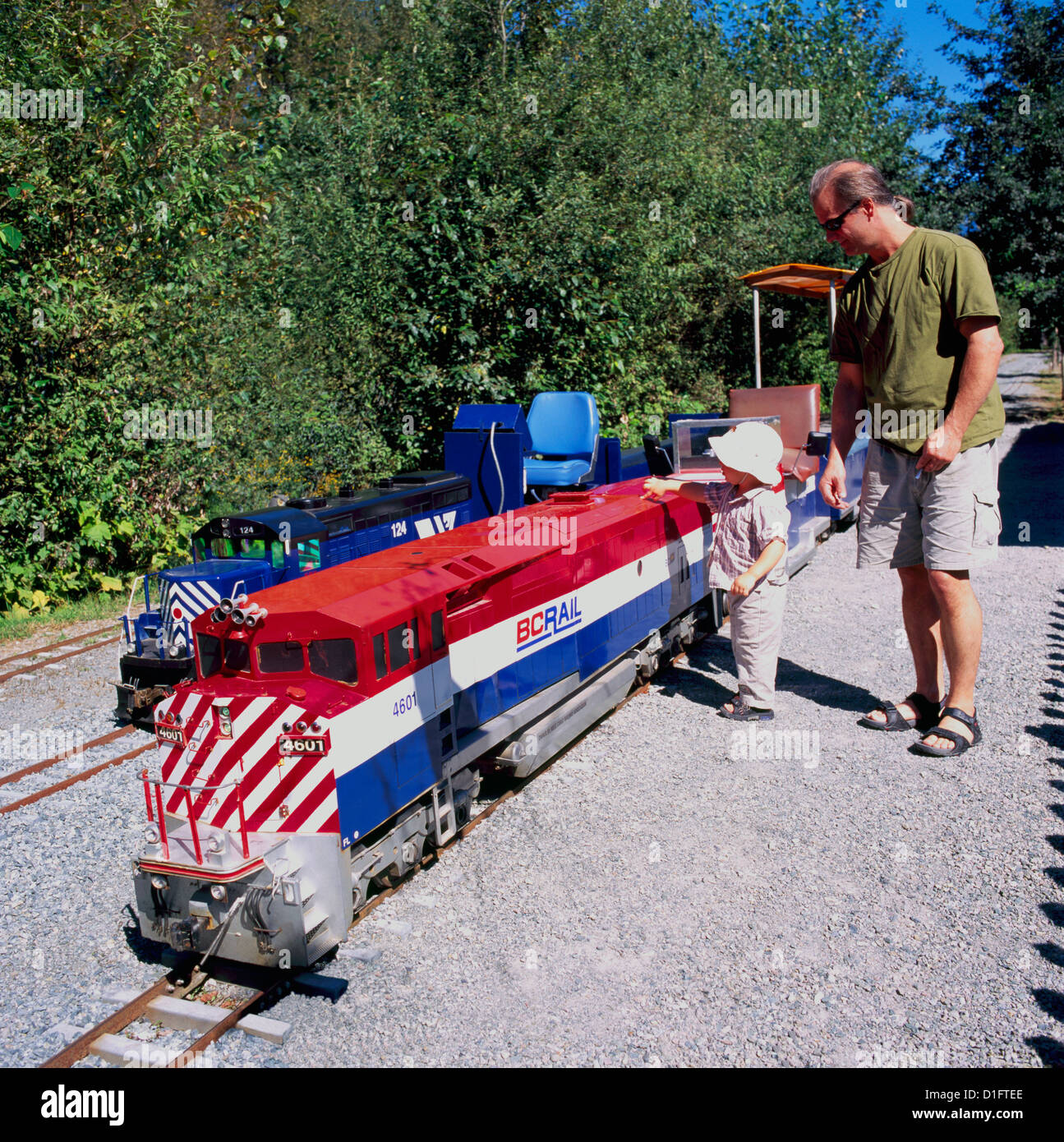 Father and Son admire Miniature Train Locomotive Engine at West Coast ...