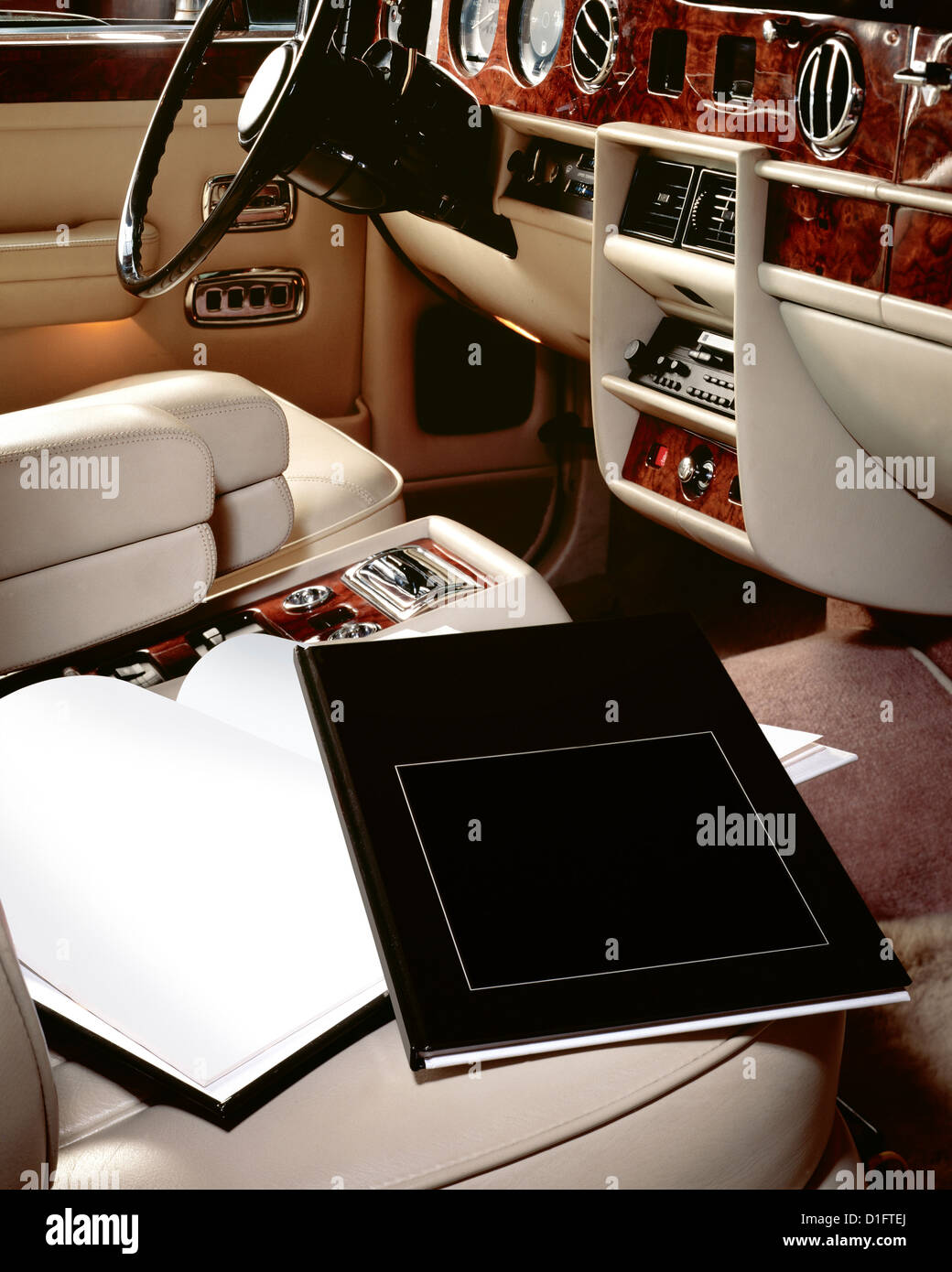 Luxury car interior with books on seat Stock Photo - Alamy