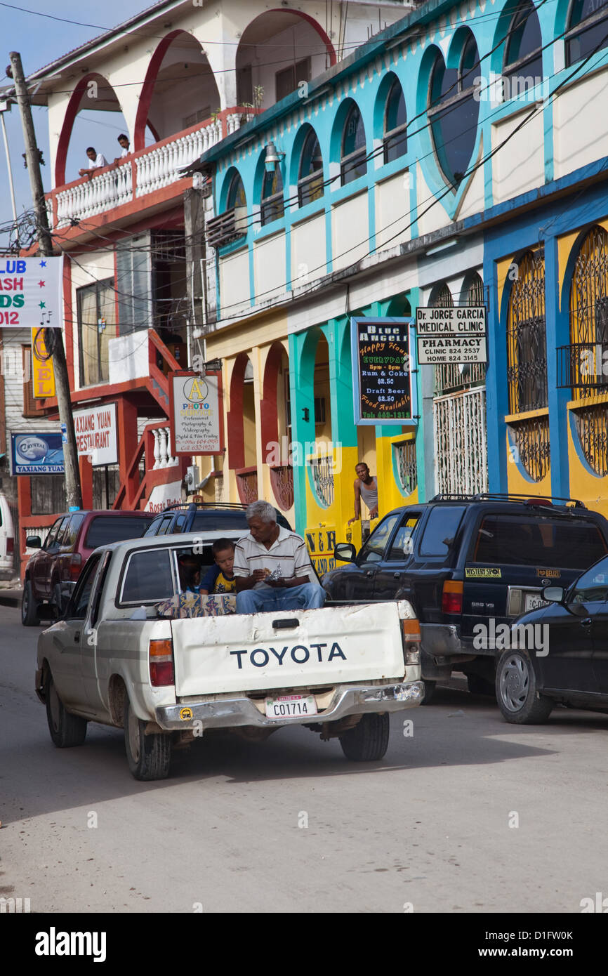 Two men riding in the back of a ute in San Ignacio, Belize Stock Photo ...