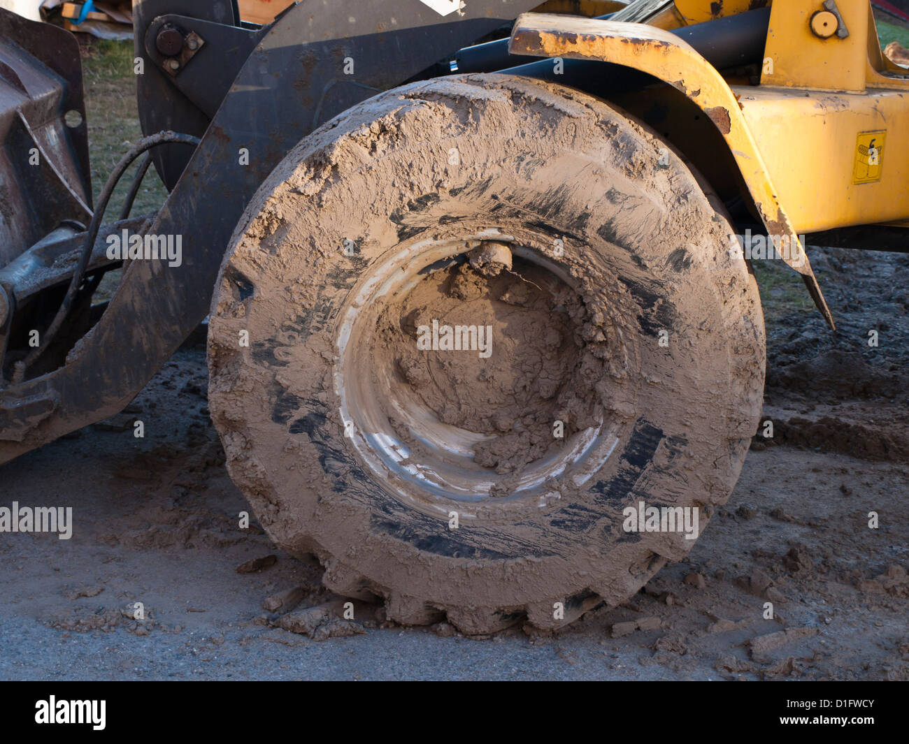 Close up of muddy wheel from road work machinery Stock Photo - Alamy
