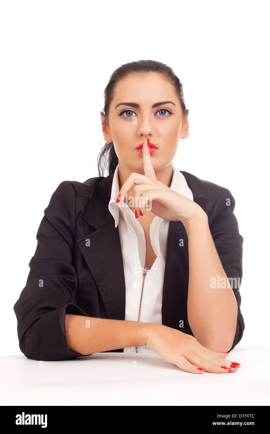Business woman shushing Stock Photo - Alamy