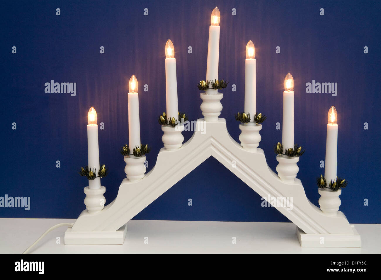 Studio seven white wooden candle arch with blue background Stock Photo ...