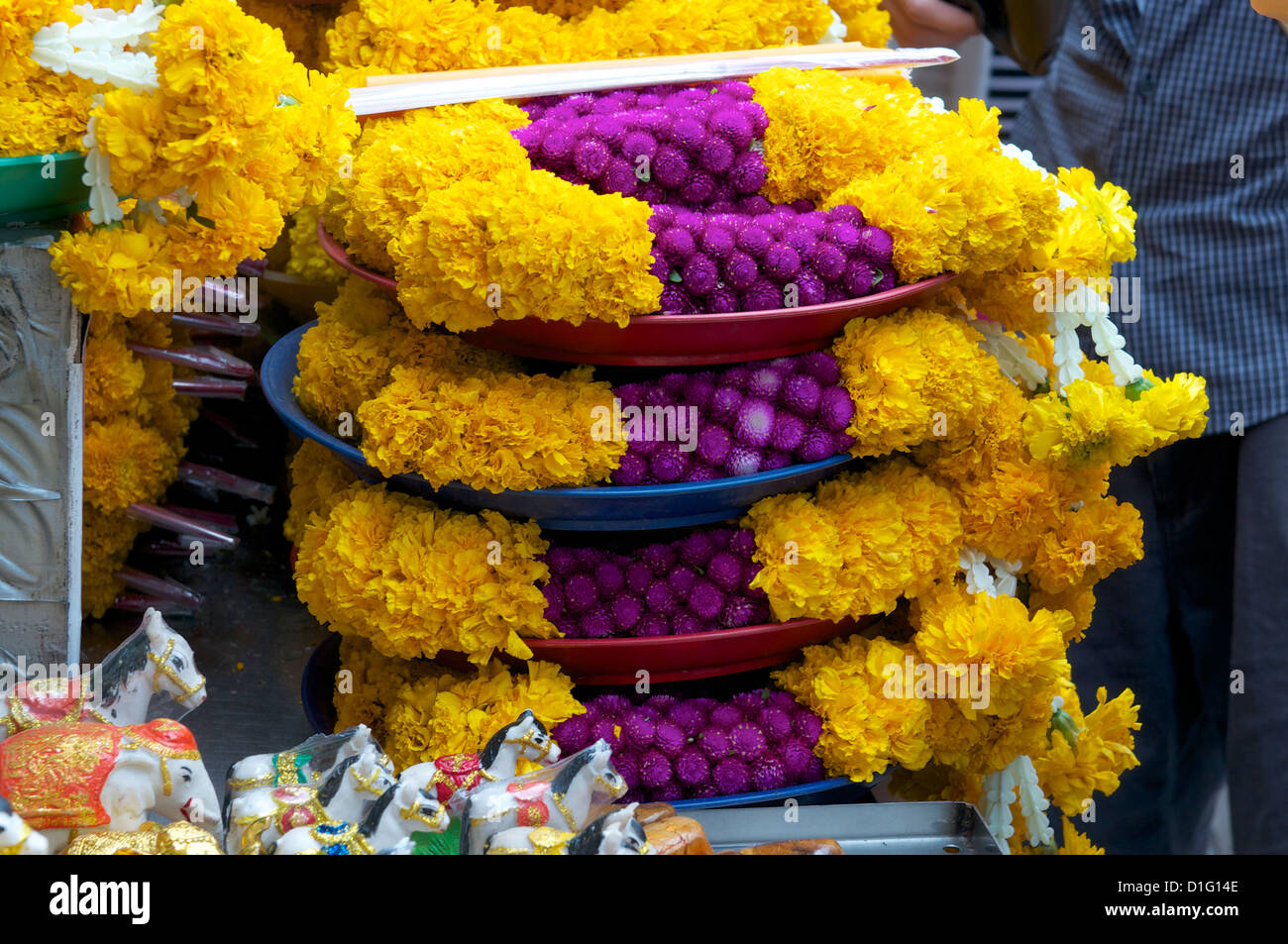 Flower offerings at The Erawan Shrine in central Bangkok Stock Photo ...