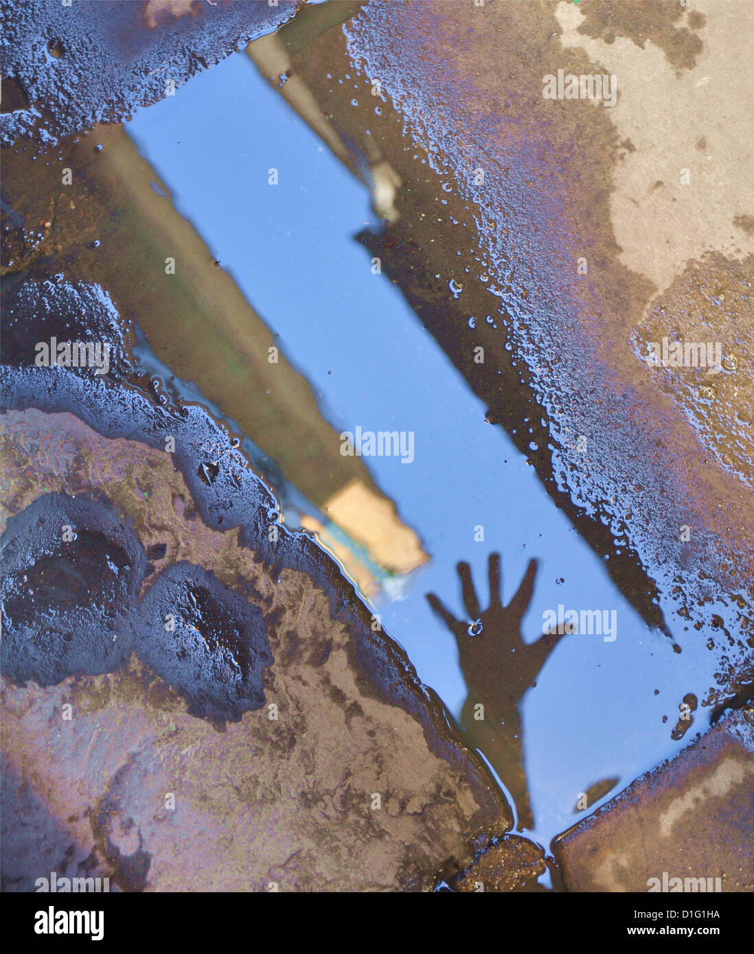 A hand reflected in a puddle Stock Photo - Alamy