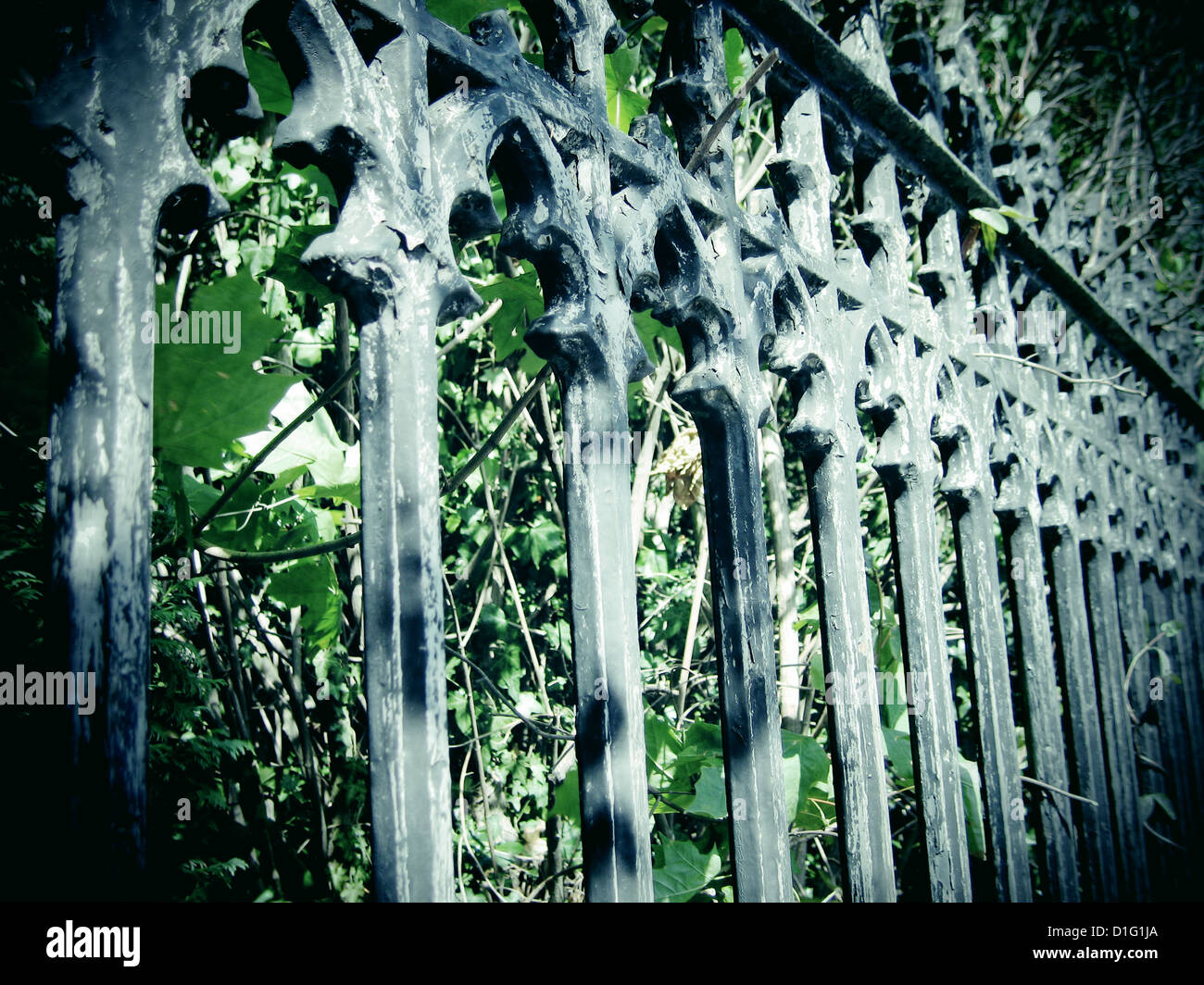 Dark metal fence at graveyard with evening light, London Stock Photo ...