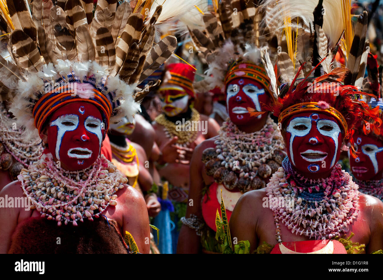 Colourfully dressed and face painted local tribes celebrating the ...