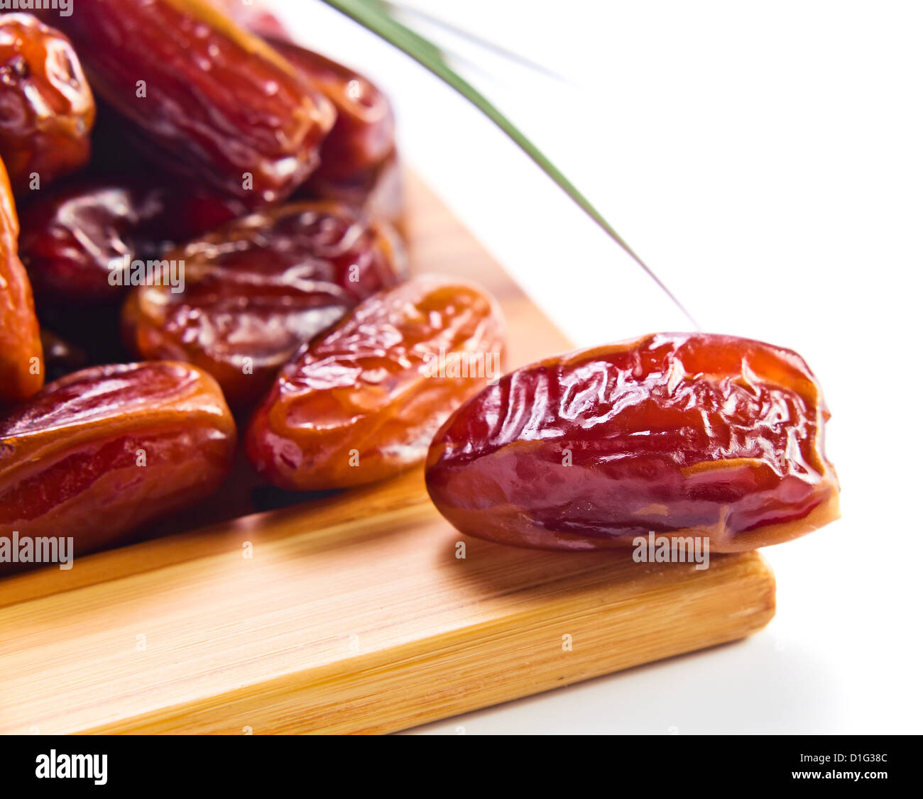 Dried dates isolated on a white background Stock Photo - Alamy